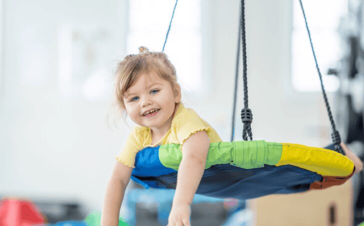 Understanding the Benefits of Swinging for Autism - Rainbow ABA Therapy